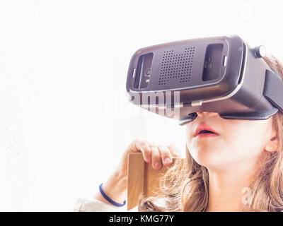 Girl wearing virtual reality glasses Stock Photo - Alamy