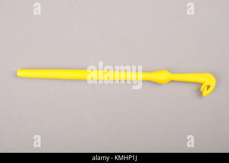 One yellow loop tier isolated on white background Stock Photo - Alamy