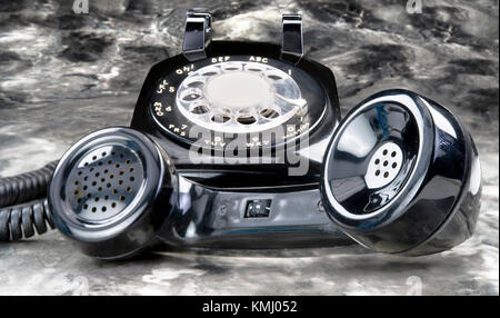 old rotary black telephone 50s - 60s with traces of time. on white ...