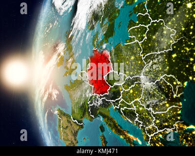 Satellite night view of Germany highlighted in red on planet Earth with ...