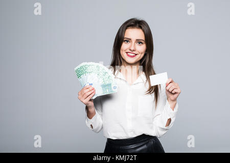 Beauitful woman holding some Euro currency notes, isolated over white ...