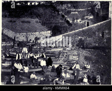 The fishermen fishing from a small dock in the morning mist on Spruce ...