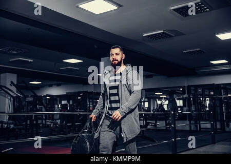 Confident young sportsmen leaving gym Stock Photo - Alamy