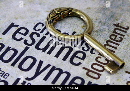 Golden key on resume text Stock Photo - Alamy