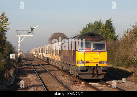 A class 60 diesel locomotive number 60007 working a freight train of ...