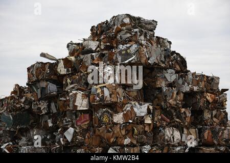 Compressed cubes of scrap metal at a junk yard Stock Photo - Alamy