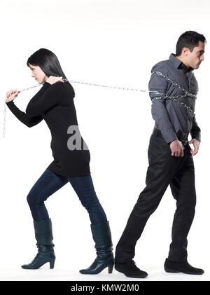 woman binding his man with a chain on white background Stock Photo - Alamy