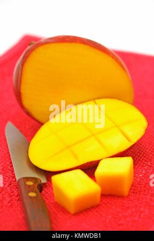 Still life with red mango, yellow lemons and dark background Stock ...