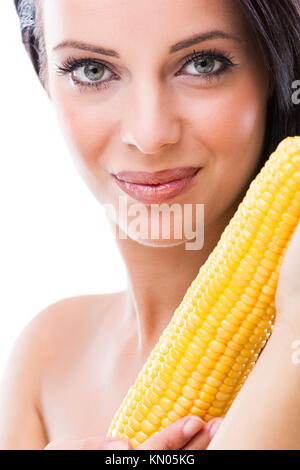 Mature female farmer with ripe corn cobs isolated on white background ...