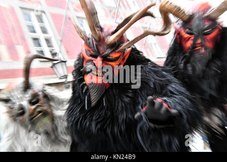 Munich, Germany. 10th Dec, 2017. People wearing scary masks during the ...