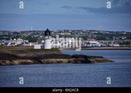 View from sea to Stornoway with Arnish Point Lighthouse in prominent in ...