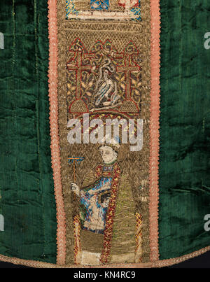 This chasuble, a liturgical vestment, represents ecclesiastical attire ...