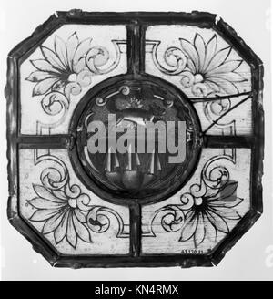 This armorial panel displays heraldic designs representing family or ...