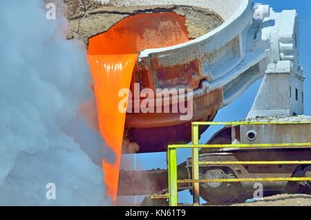 Ladle pouring molten steel and slag at Hagfors steel mill in Sweden ...