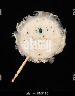 This fan in the museum collection demonstrates detailed craftsmanship ...