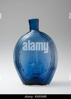 This figured flask features intricate designs, likely used for holding ...