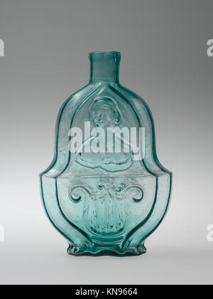 This figured flask features intricate design elements, combining both ...