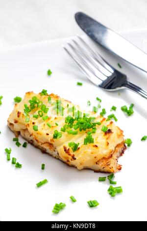 Baked Cod fish with mashed potato Stock Photo - Alamy