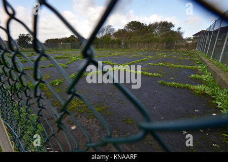 Rundown sports ground on a wet day Stock Photo - Alamy