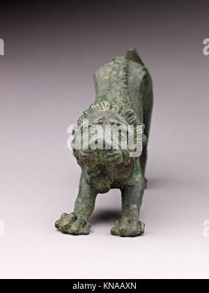 This crouching lion sculpture is a representation of strength and ...