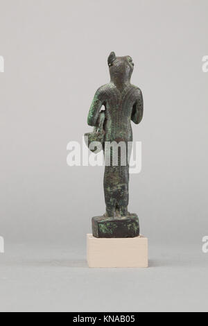 This figurine represents the ancient Egyptian goddess Bastet, depicted ...