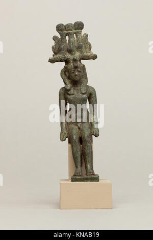 This sculpture of a child god, wearing a nemes and hemhem crown ...