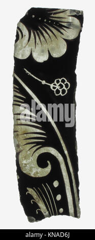 This fragment represents a small portion of a larger object, offering a ...