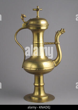 This ewer, a historical vessel designed for pouring liquids, features ...