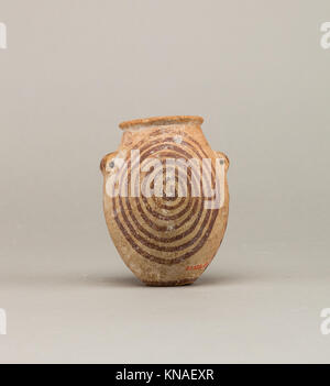 This decorated ware jar features intricate depictions of boats and ...