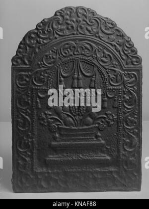 This fireback is a metal fireplace object designed to protect walls ...