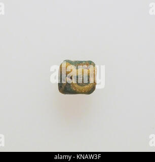 This ancient bead demonstrates intricate design and cultural ...