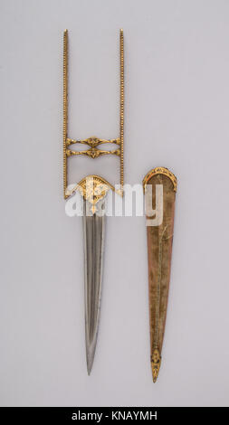 This traditional Indian katar dagger with sheath demonstrates ...