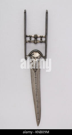 A traditional Indian katar with horizontal grip and protective guard ...