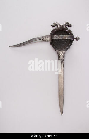 This Katar dagger, known for its distinctive triangular blade, is a ...