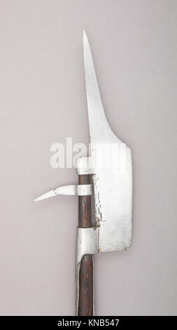 This halberd, a medieval weapon featuring an axe blade, spear point ...