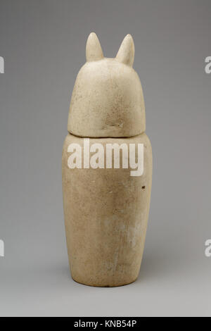 This canopic jar features the head of Duamutef, a jackal-headed deity ...
