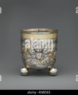 A glass or ceramic beaker illustrating functional and decorative design ...
