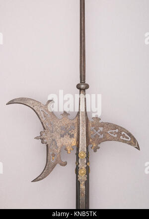 This halberd, a type of pole weapon, features a blade, spike, and hook ...