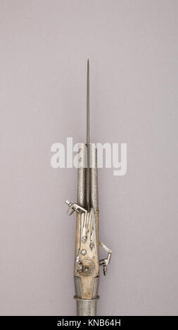This boar spear with a double-barrel wheellock pistol demonstrates 16th ...