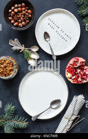 Christmas table setting with empty ceramic plates, traditional ...