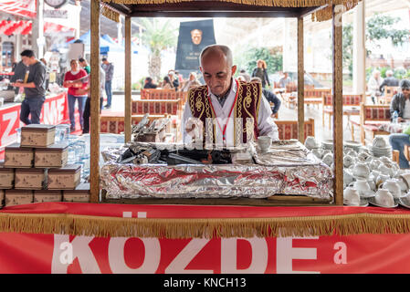 Unidentified Turkish man in a Small coffee shop cooks "Turkish Coffee ...