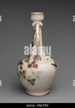 This ewer, a type of pitcher, is crafted from metal and is an example ...