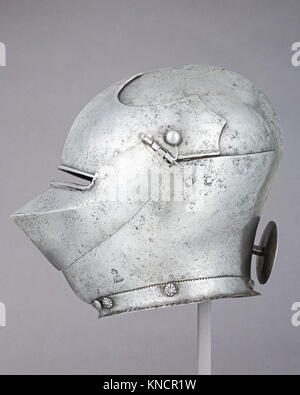 This armet helmet illustrates medieval combat armor, military ...