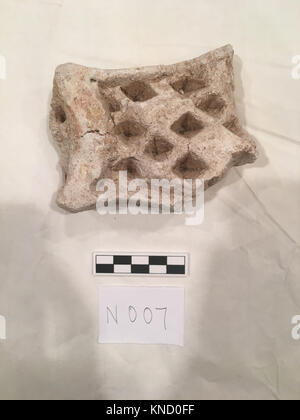 This carved and painted stucco fragment from the 8th–12th century ...