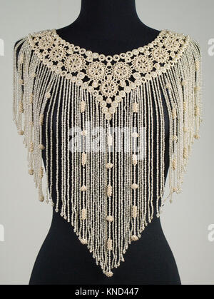 This ancient collar demonstrates intricate design and craftsmanship ...