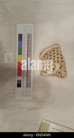This fragment reveals aspects of the original object, providing ...