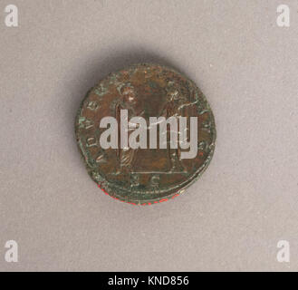 A metal coin from the Metropolitan Museum of Art, featuring engraved ...