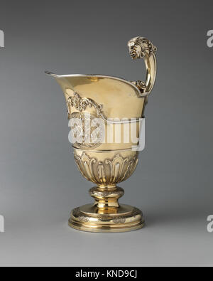 This ewer, a metal pitcher, illustrates fine craftsmanship, detailed ...