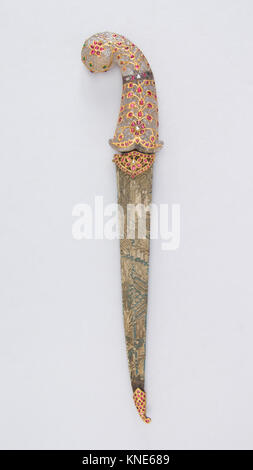 This dagger with sheath displays detailed design and craftsmanship ...