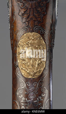 This flintlock gun, a historical firearm, represents the weaponry of ...